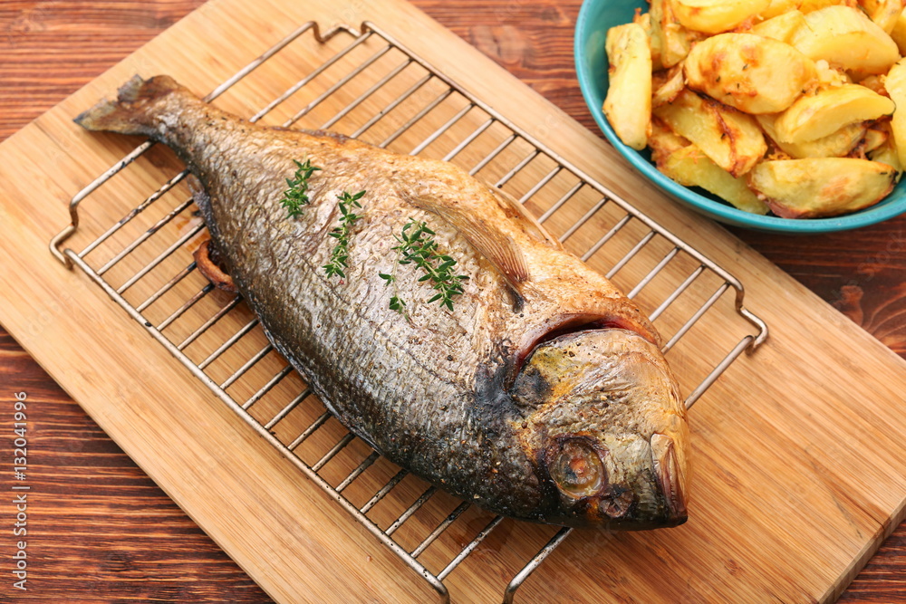 Whole fried dorado fish Stock Photo | Adobe Stock