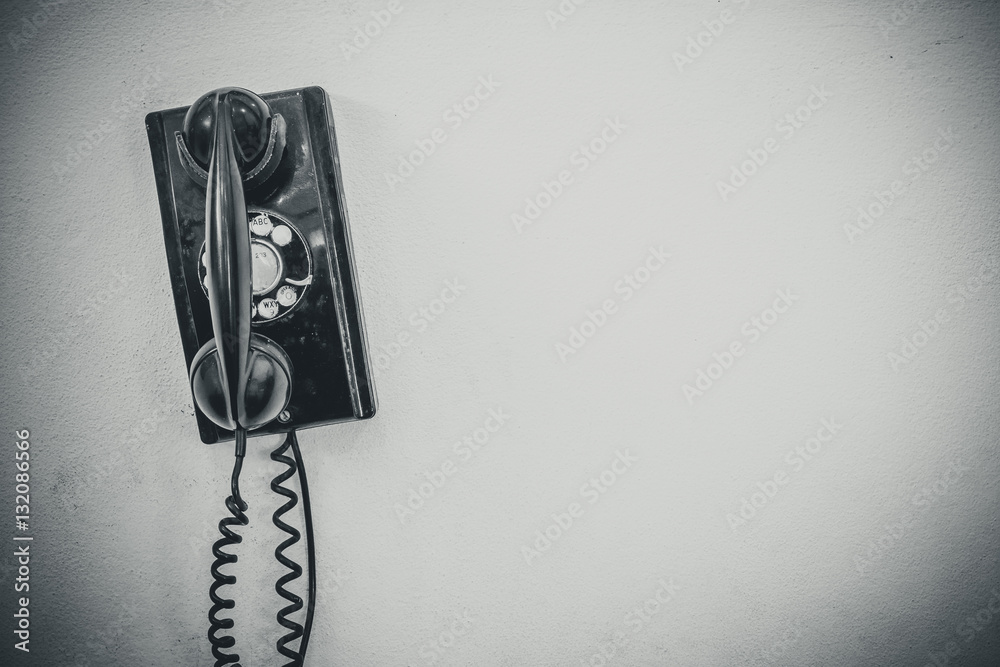 Black antique vintage analog telephone dialing or scrolling phone on ...