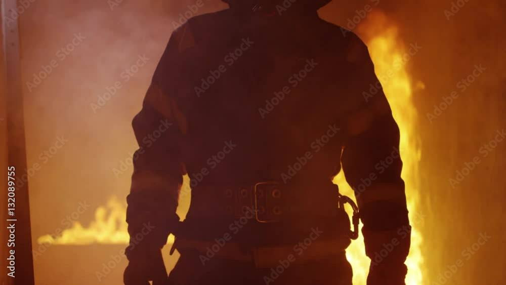 Portrait Shot of A Brave Fireman Standing in a Burning Building Fire ...