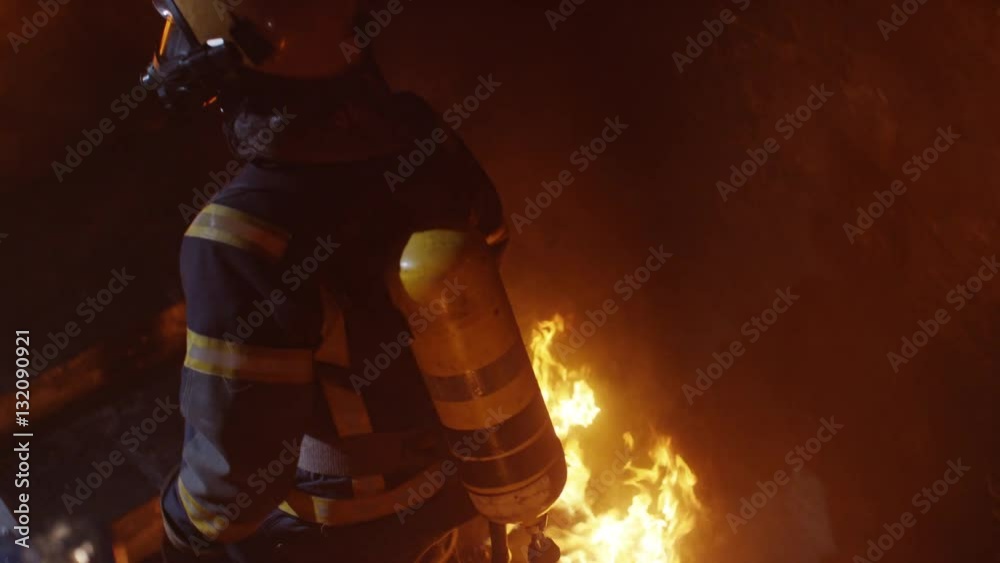 Brave Fireman Goes Up Burning Stairs. Building is on Fire. Flame and ...