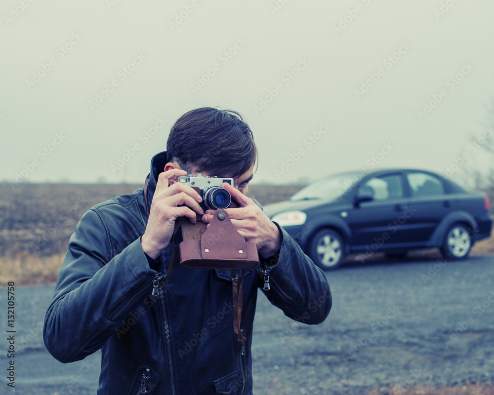 tourist with a film camera Stock Photo | Adobe Stock