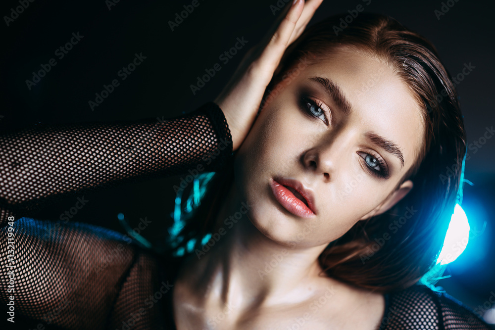 Fashion model beautiful girl in fashionable clothes in ultraviolet ...