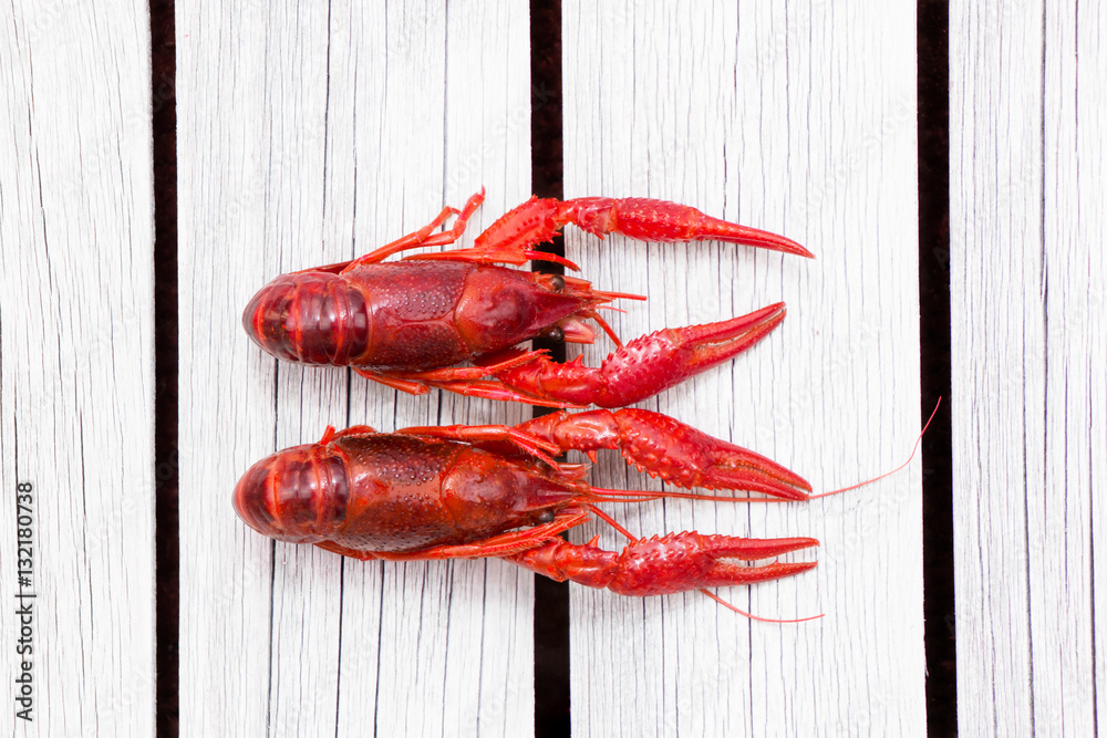 Red steamed crawfish on the white wooden background. Boiled crayfish ...