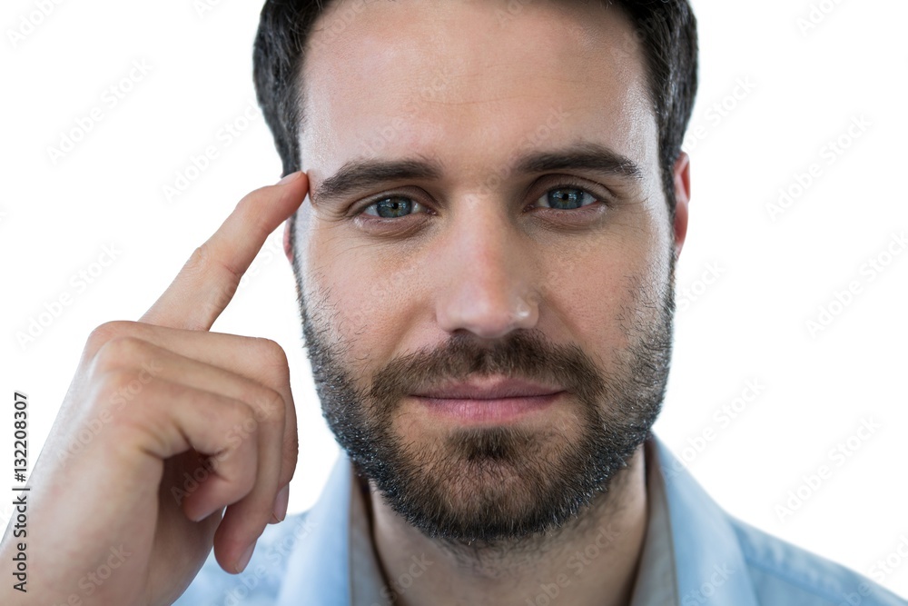 Man with finger pointing to head foto de Stock | Adobe Stock