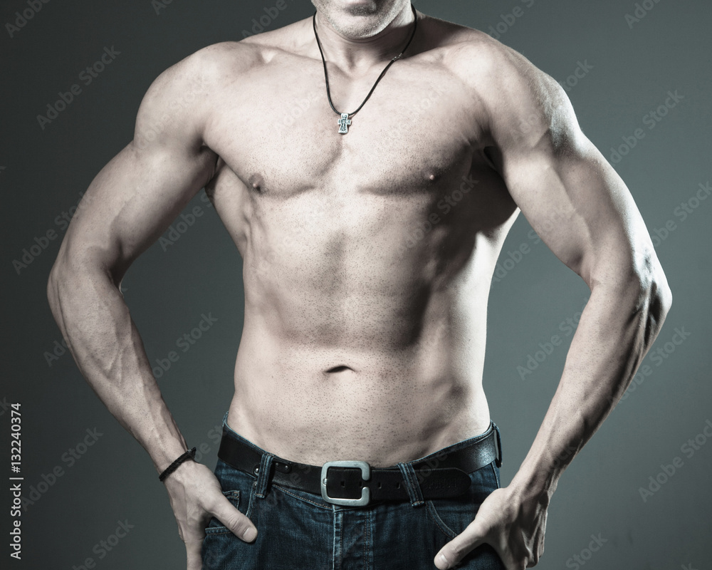 Strong man with perfect abs, shoulders, biceps, triceps and ches Stock ...