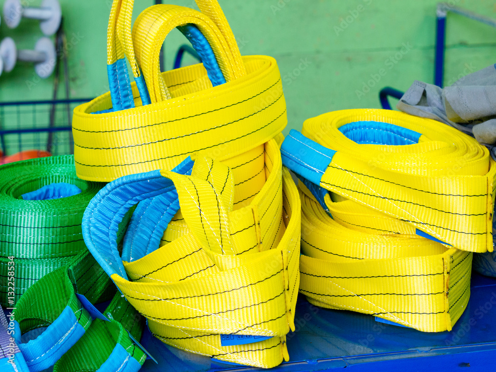 Colorful nylon soft lifting slings stacked in piles Stock Photo | Adobe ...