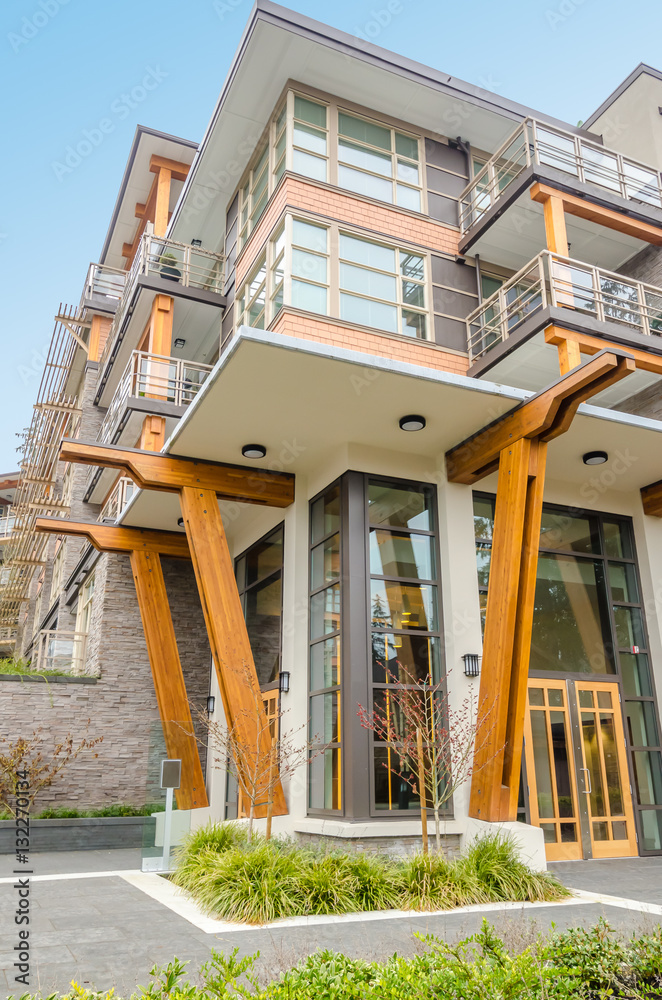 Corner of a building with wooden beams and two entrances. Stock Photo ...