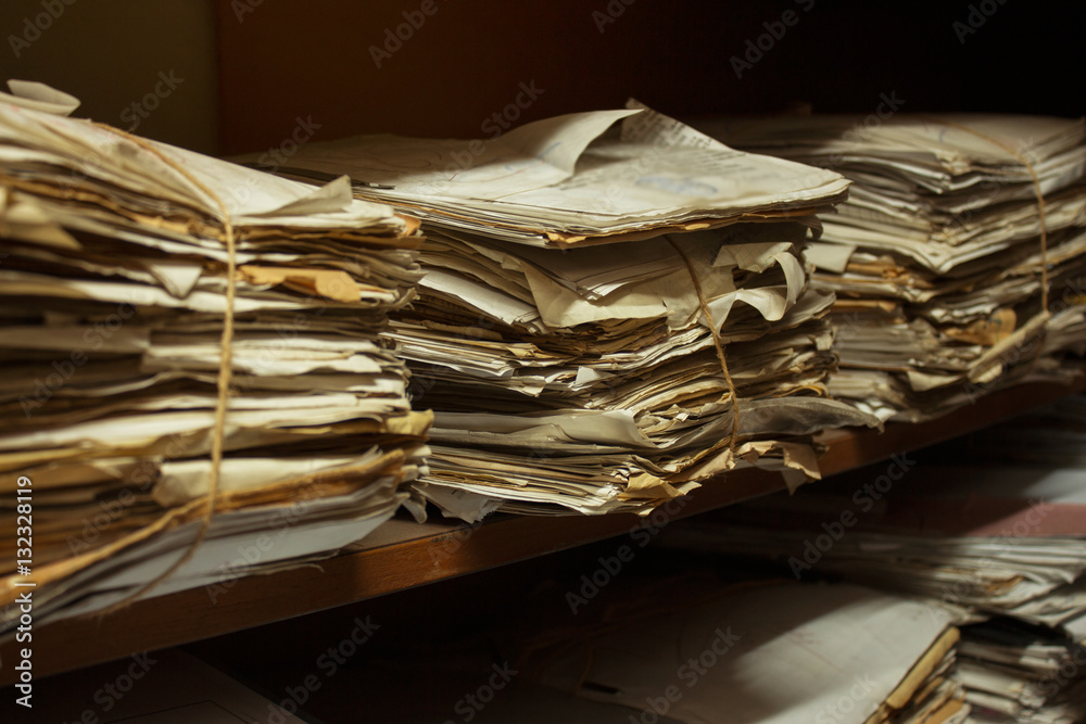 Dusty old stack of papers and files in archive room of office Stock ...