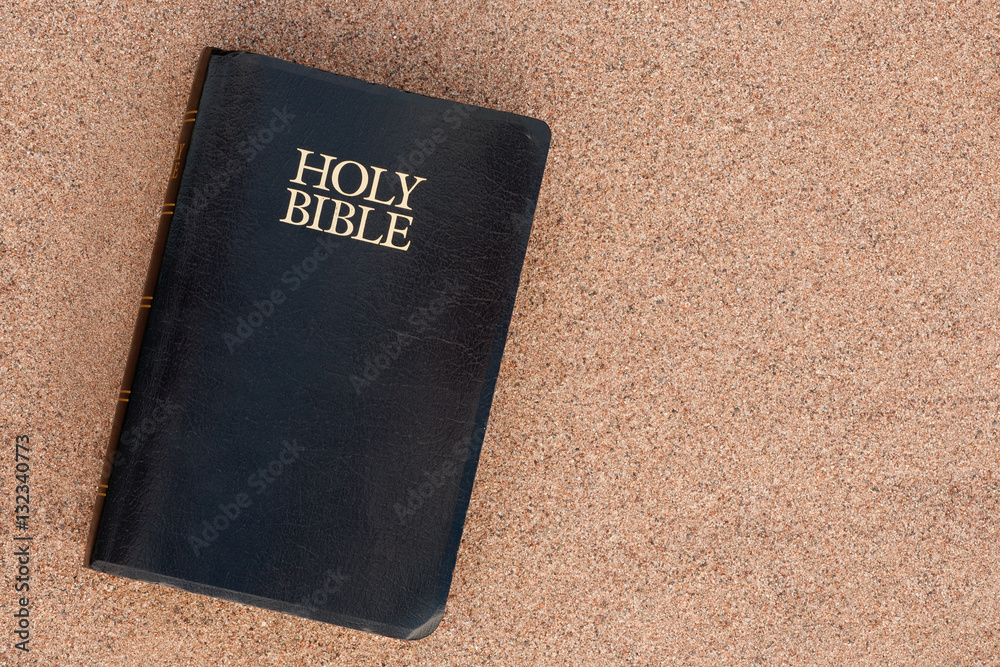 Holy Bible on sand. Top down view. Stock Photo | Adobe Stock