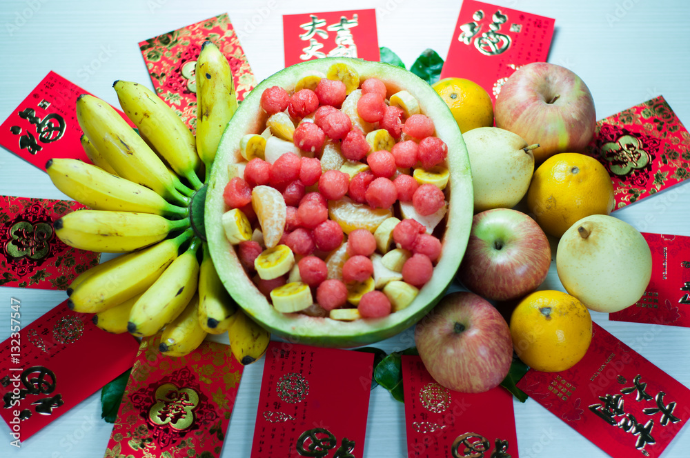 various fruits in chinese new year, orange, watermelon, apples, pears ...