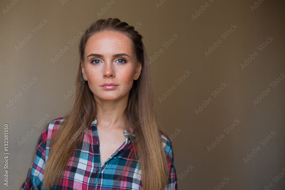 Beautiful woman's portrait on the neutral background. She has go Stock ...