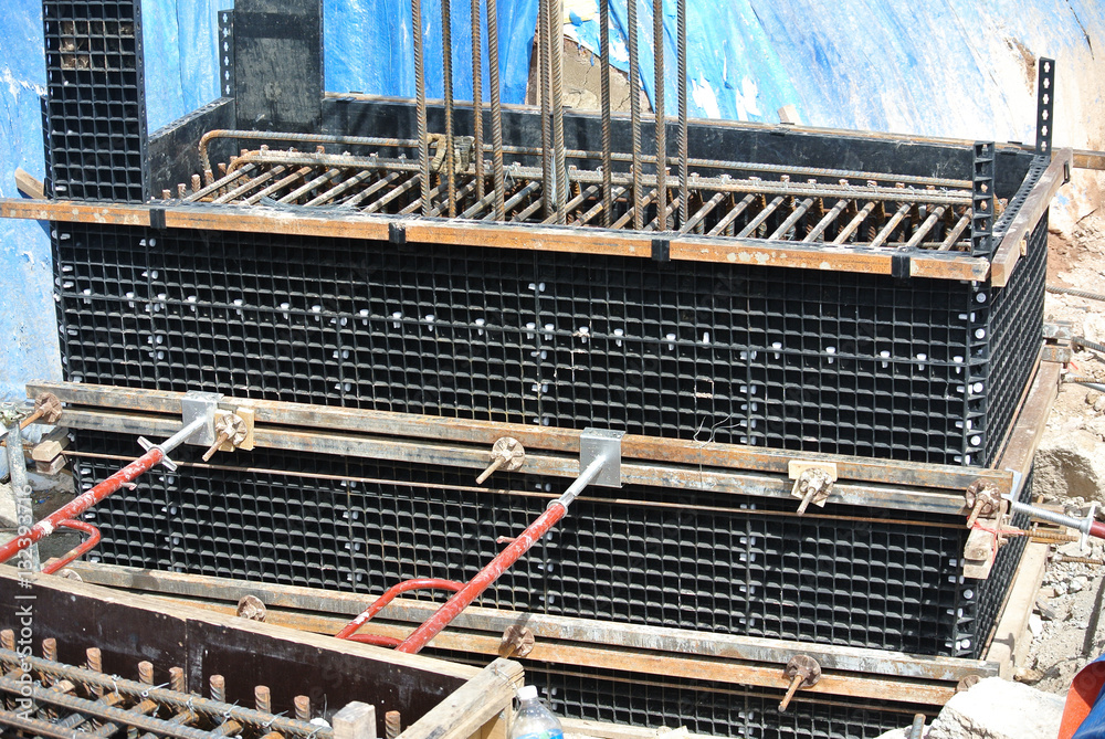 Pile cap form work with reinforcement bar in it at construction site in ...