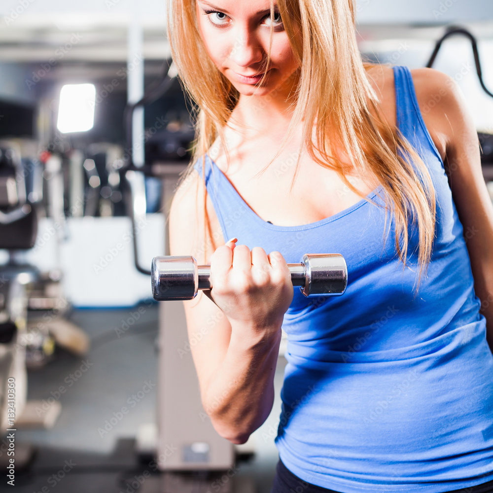 Fitness female woman with muscular body, doing her workout with ...