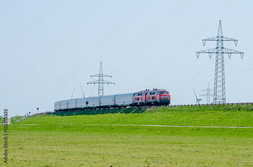 German train driving on Hindenburg Dam towards the island Sylt with ...