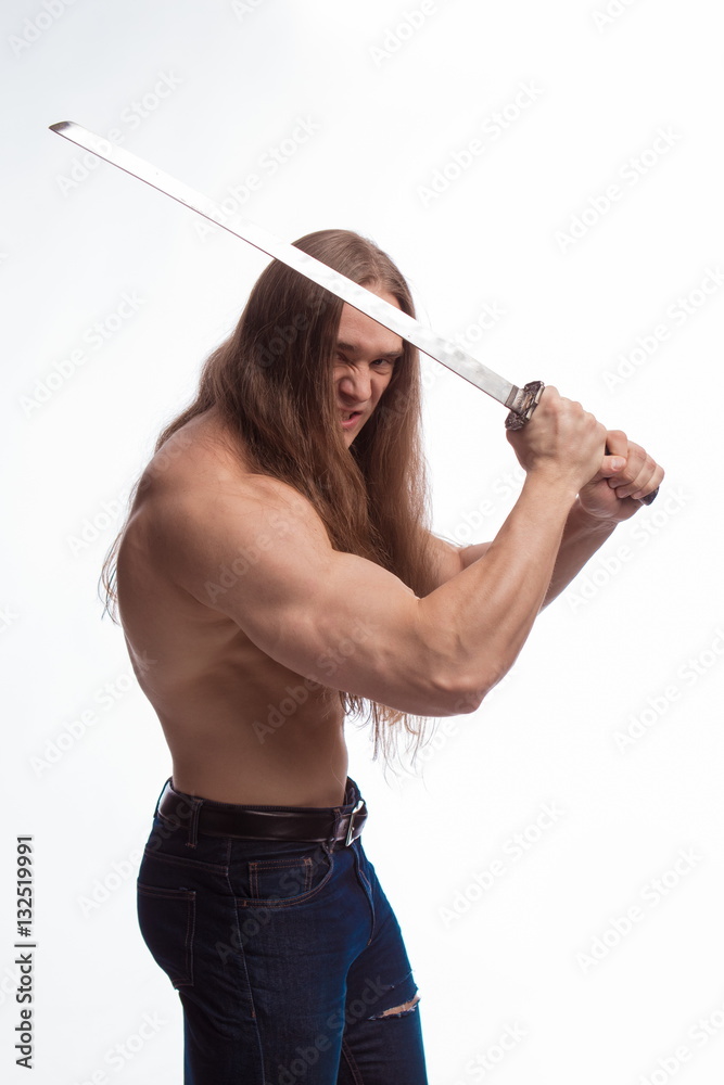 Portrait of a brutal man bodybuilder with bare-chested with long hair ...