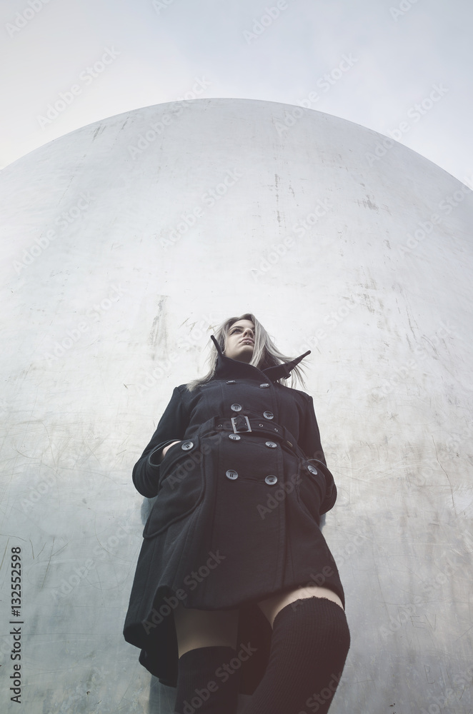 Blonde young girl on curved background in provocative pose looki Stock ...