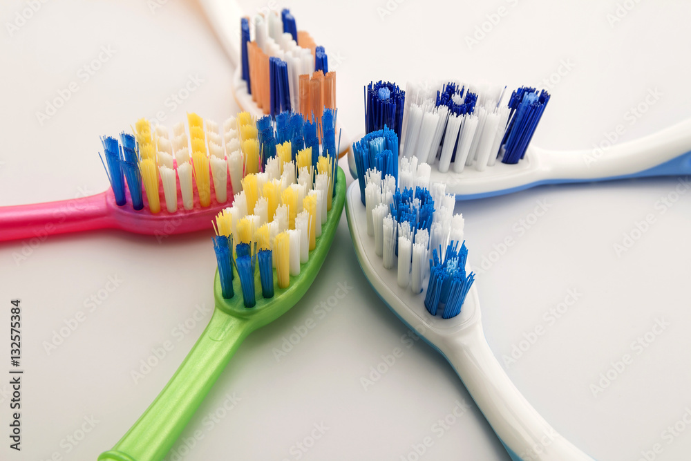 Colorful toothbrushes on white background with copy space. Macro Stock ...
