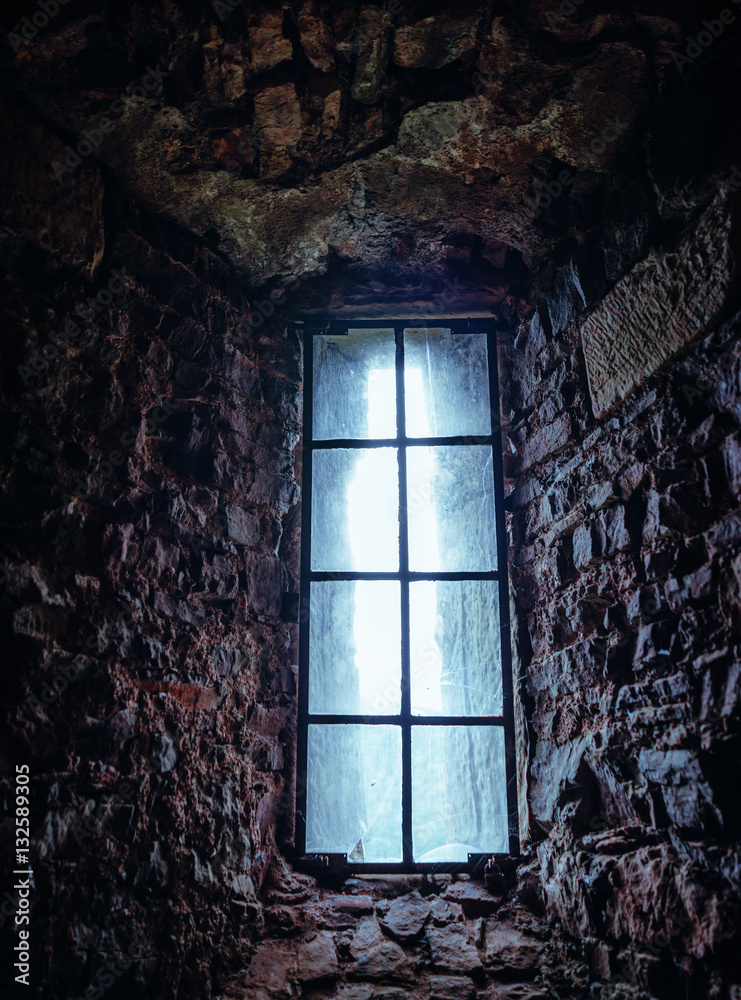 Stone house. Dark room with window Stock Photo | Adobe Stock