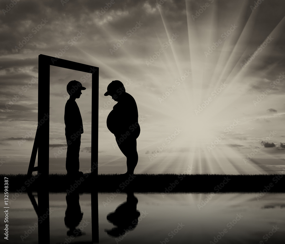 Foto de Fat boy and his reflection in mirror of a normal boy against ...