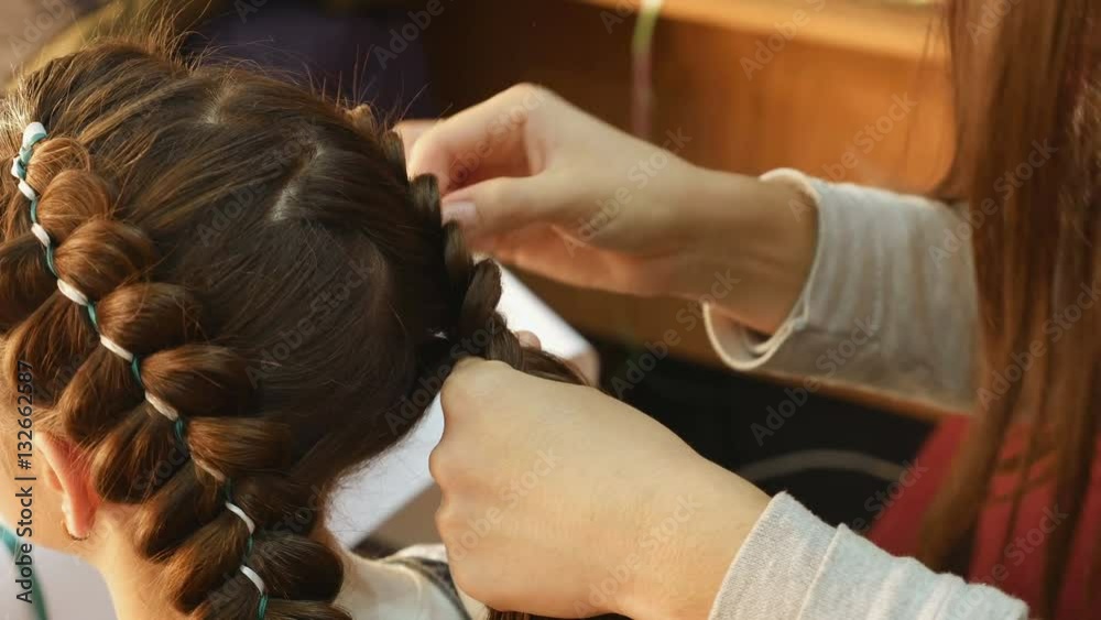 Female model getting her hair dressed before an event. Makeup ...