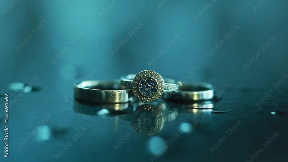 Wedding rings illuminated with artificial source of light from top ...