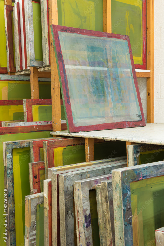Silk screen printing screens stored in a wooden rack ready for printing ...