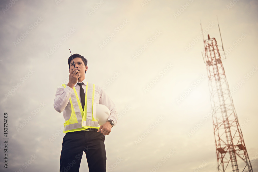 engineer standing hold radio for order construction crews to work ...