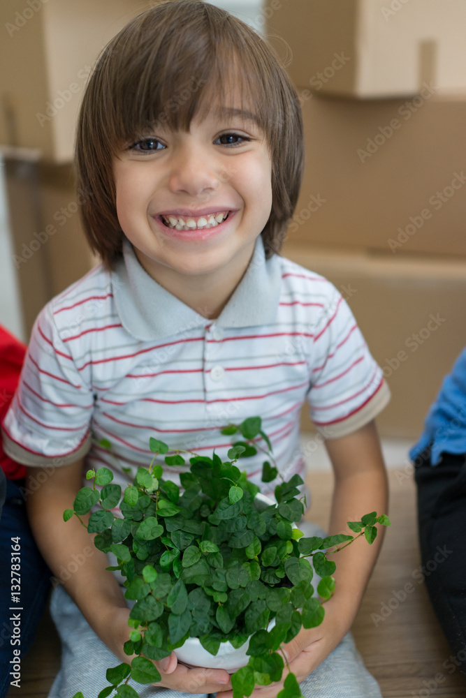 Little cute boy in empty room, remoove to new house home alone b Stock ...