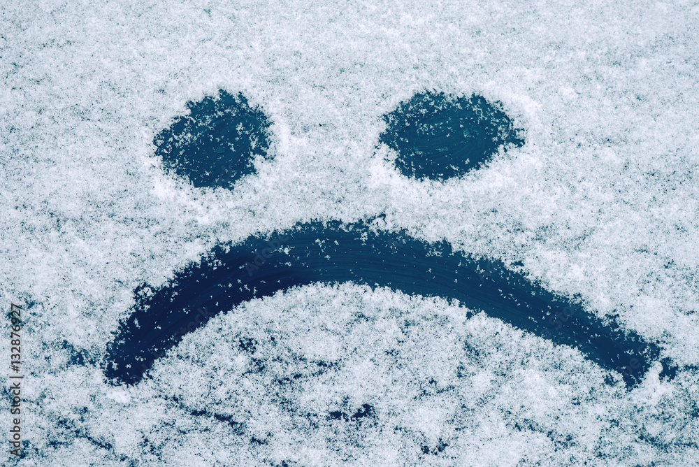 Sad smiley emoticon face drawn on snow covered glass Stock Photo ...