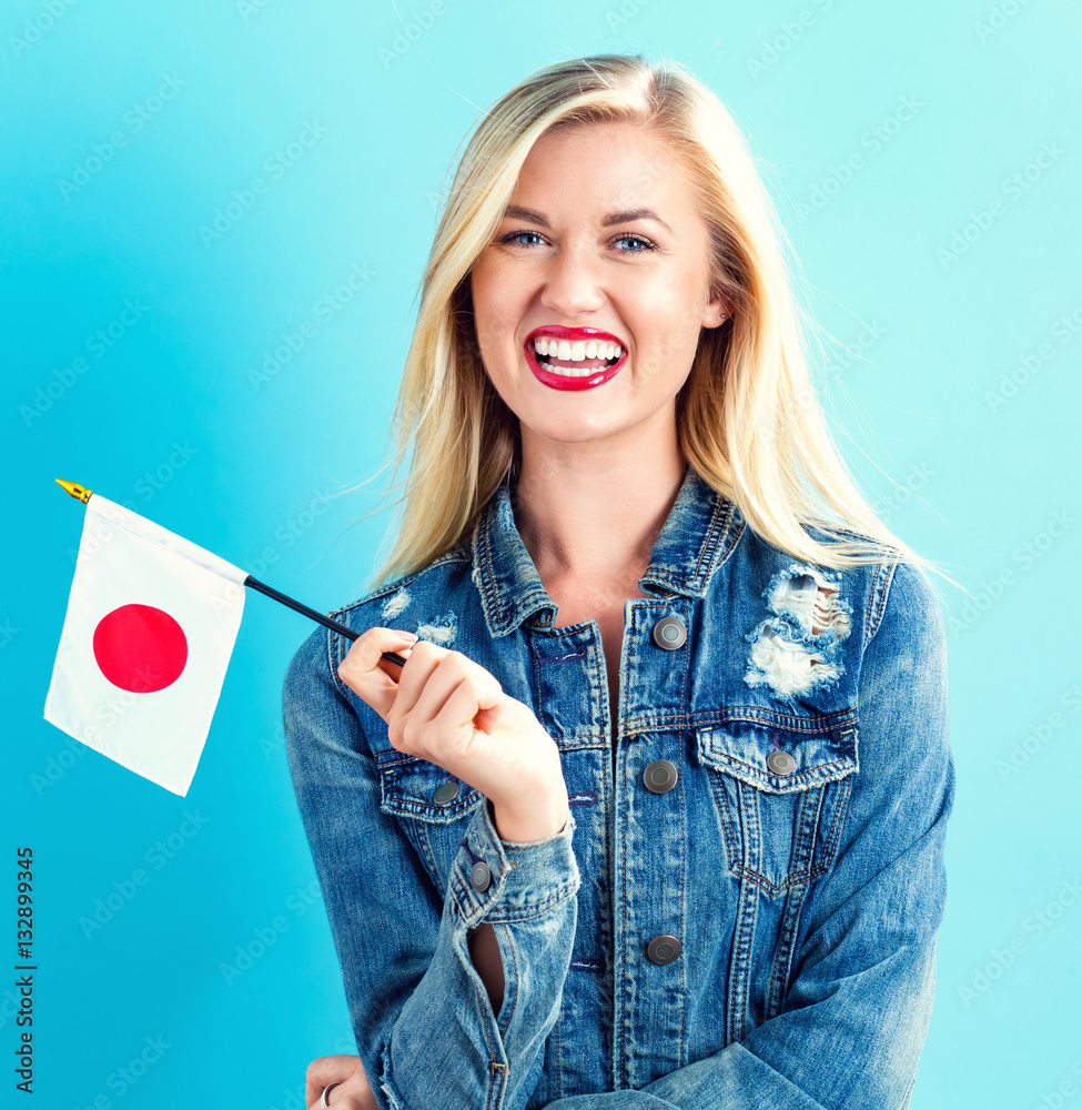 Young woman holding Japanese flag Stock-Foto | Adobe Stock