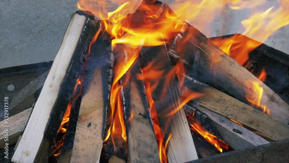 Sparks fire cracks in grill fire pit. Burning ash rise from large fire ...