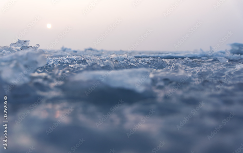 Small ice crystals on frozen sea. Selective focus and shallow depth of ...