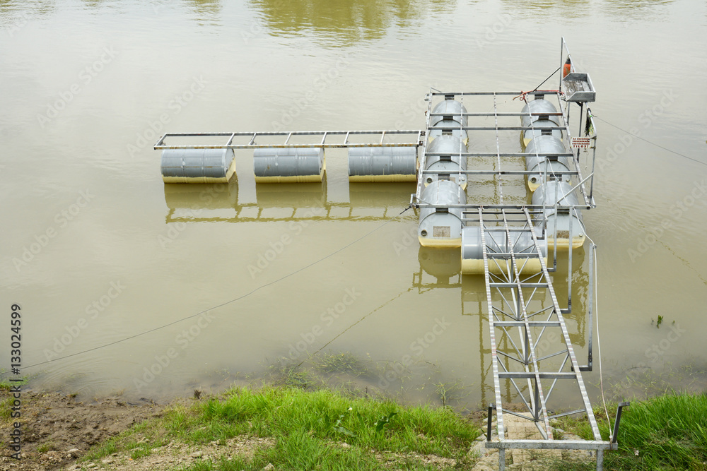 Metallic frame and structure of a small recreational pier at a river ...