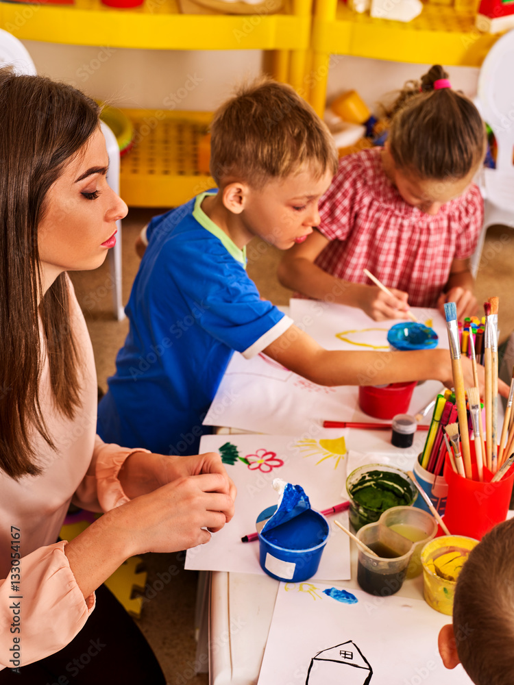 Children painting and drawing in kids club. Art lesson in primary ...