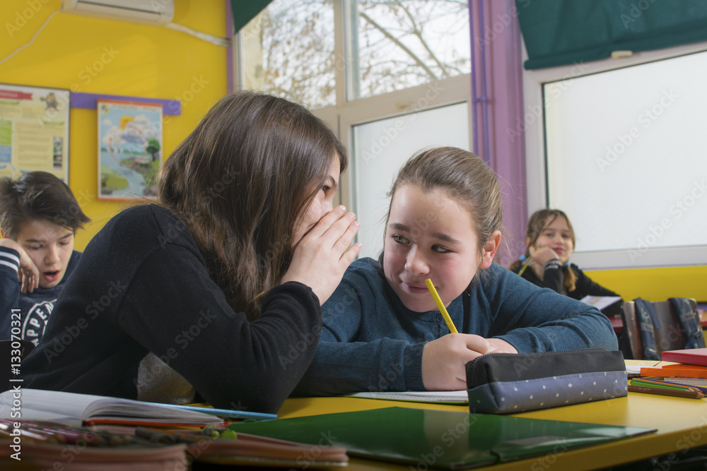 Students Whispering In Class