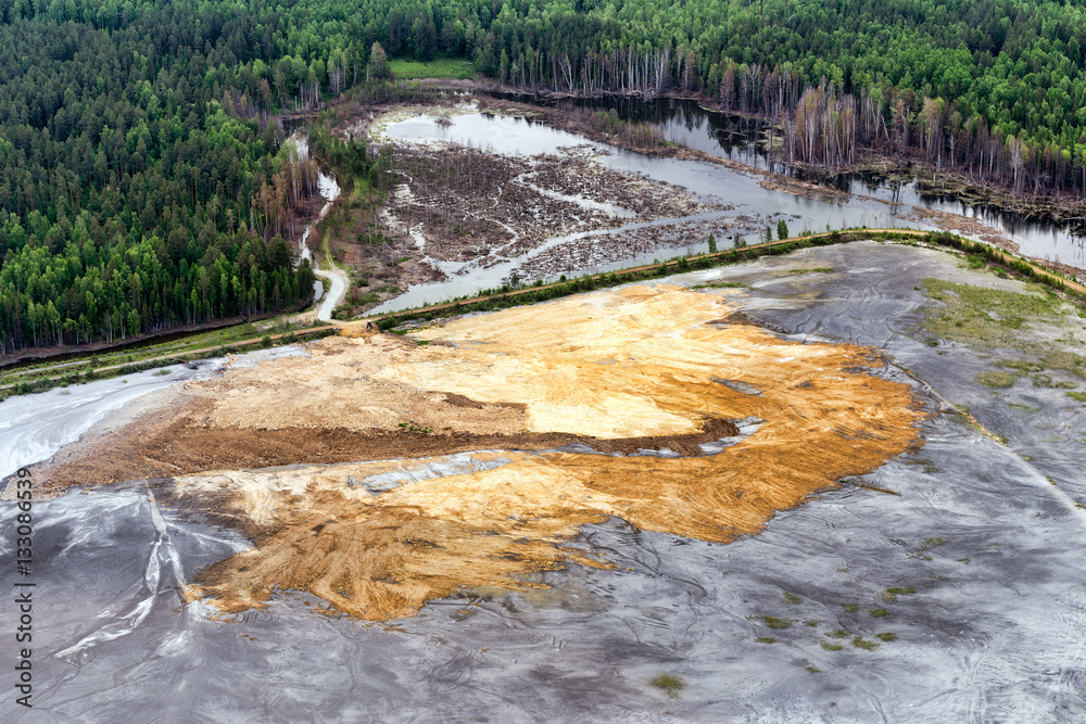 Sludge waste. Dirty blue and green water in reservoir. Environmental ...