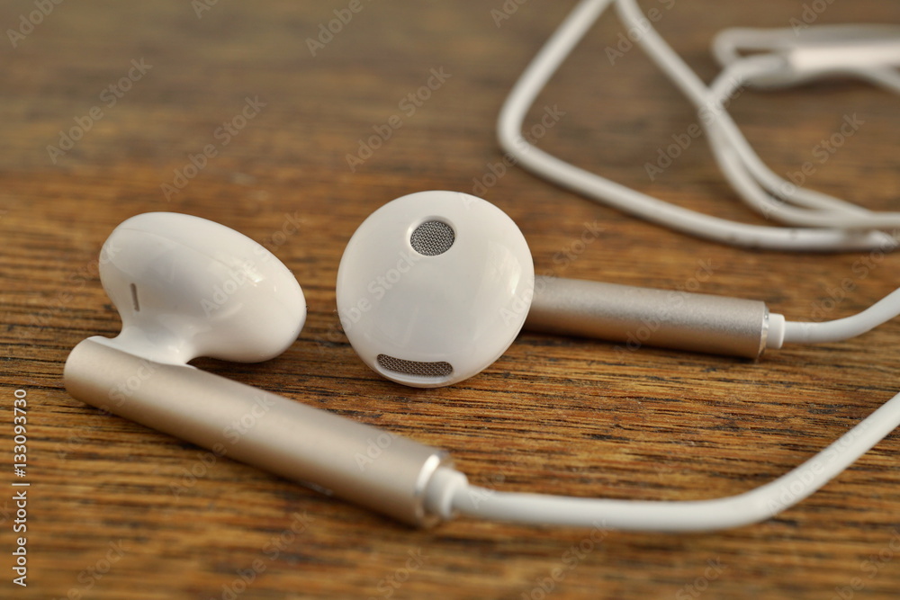 Macro detail of white modern earphones in futuristic design on the ...