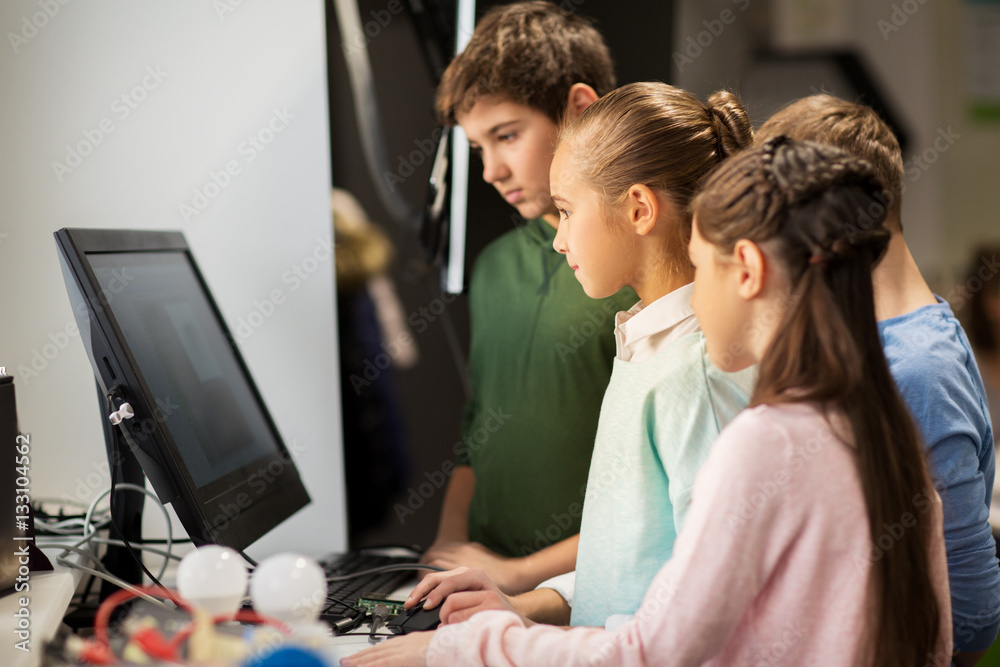 happy children with computer at robotics school Stock Photo | Adobe Stock