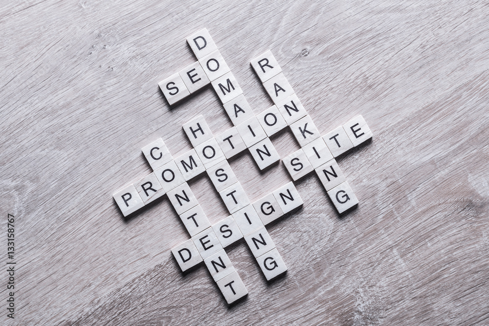 Conceptual business keywords on table with elements of game making ...