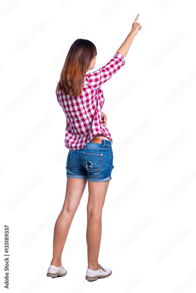 Back view of pointing woman. beautiful girl. Rear view people ...