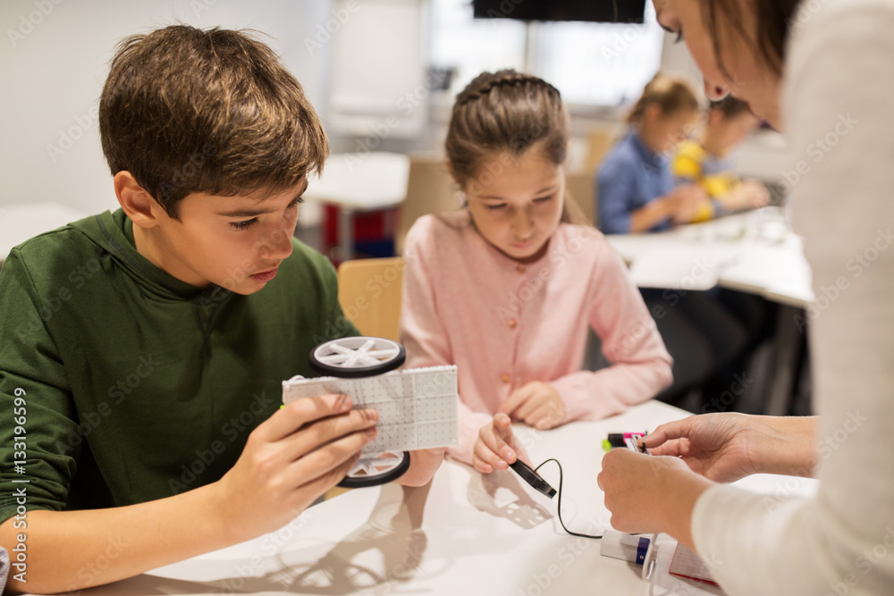 happy children building robots at robotics school Stock Photo | Adobe Stock