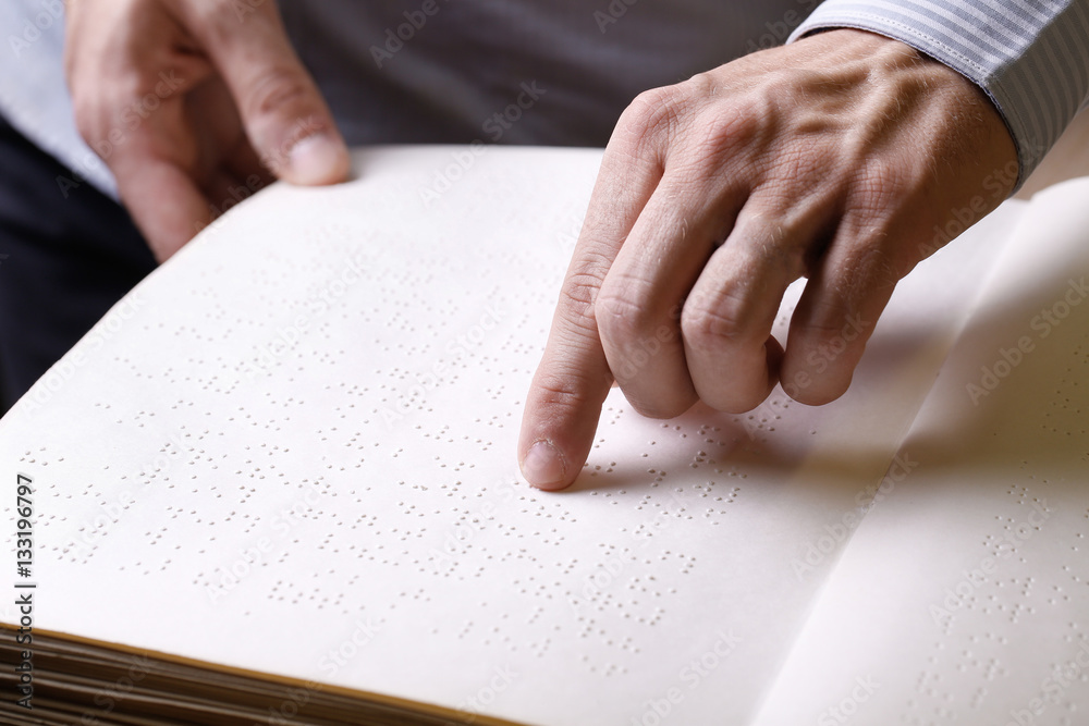 Blind person touching book, written in braille writing Stock Photo ...