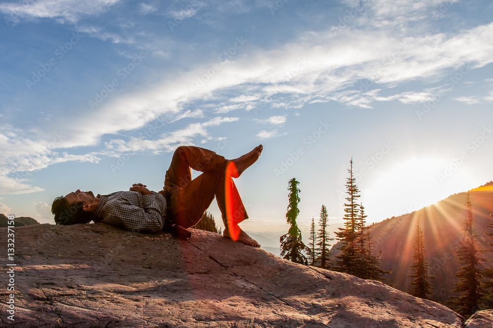 Man laying on rock, Glacier National Park, Montana Stock Photo | Adobe ...