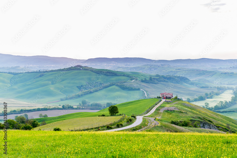 Farm on a hill in a valley of the a rural landscape Stock Photo | Adobe ...