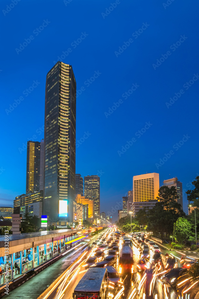 Heavy traffic in Sudirman Street, Jakarta, Indonesia at busy hour, showing lighttrail of traffic ...