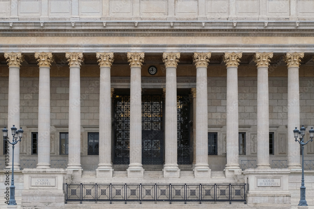 Building front of a law court in Lyon, France. In front of the entry ...