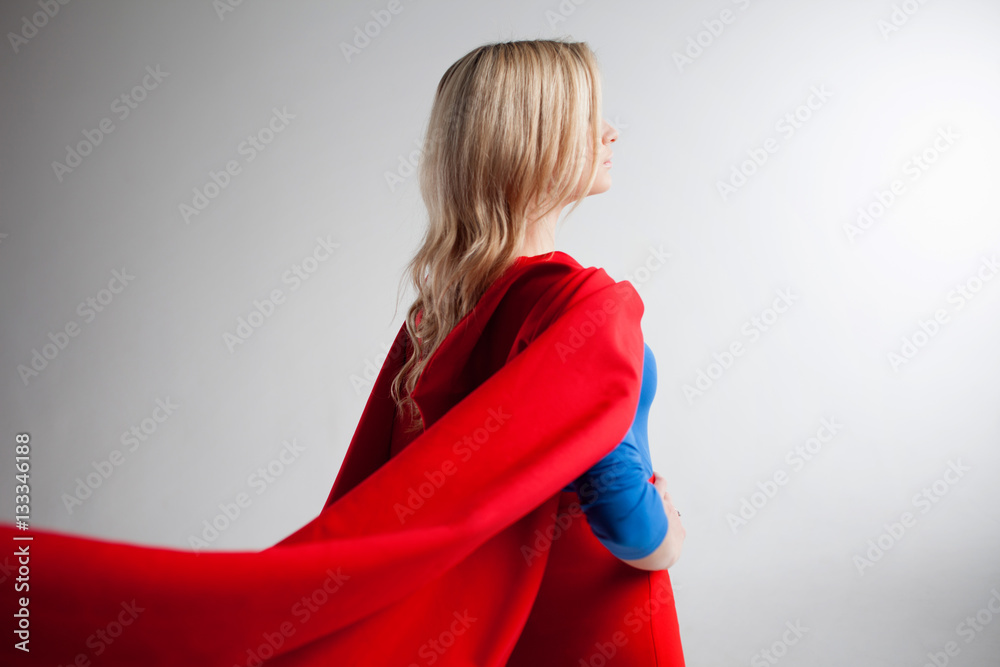 Superhero Woman looking off into the distance at right. Young and ...