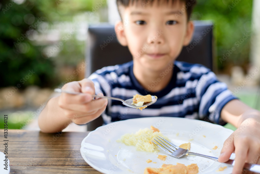 Little boy eating Stock Photo | Adobe Stock