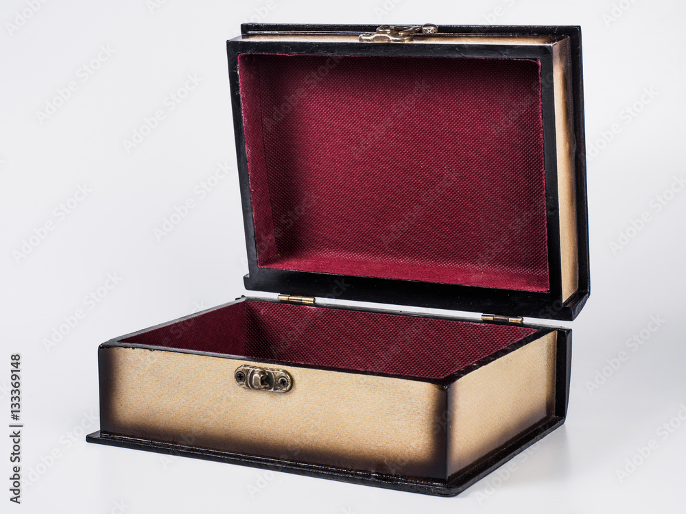 Picture of opened wooden jewel-box with red fit-out on white background ...