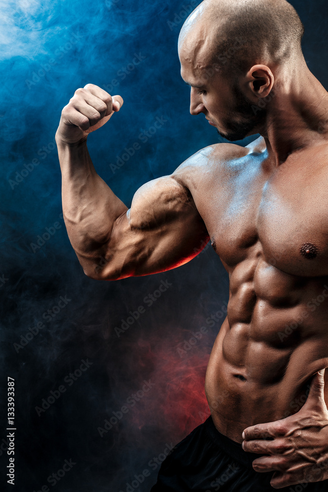 Strong bald bodybuilder with six pack. Bodybuilder man with perfect abs ...